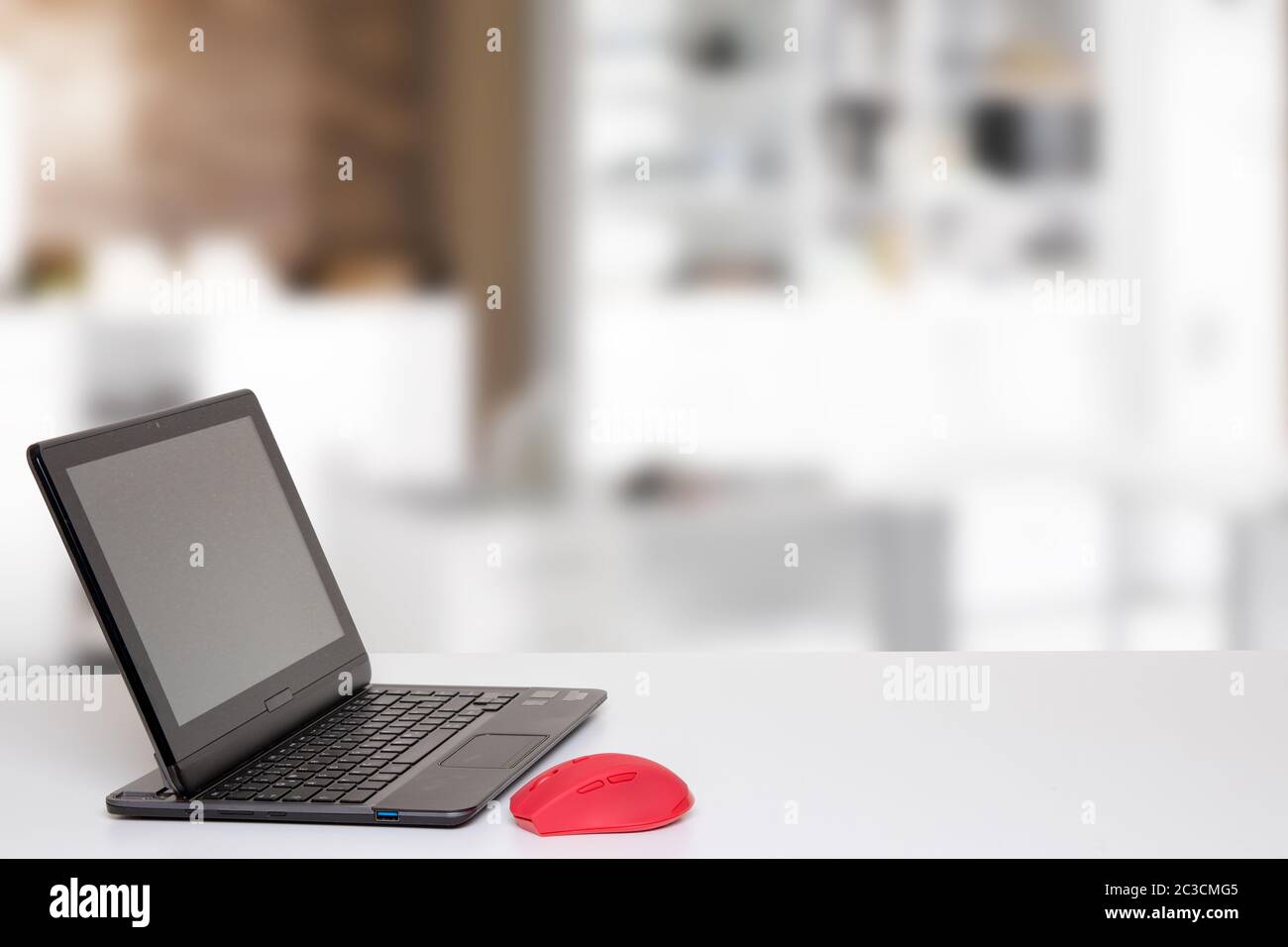 Table top on computer background. Modern portable Laptop with blank ...