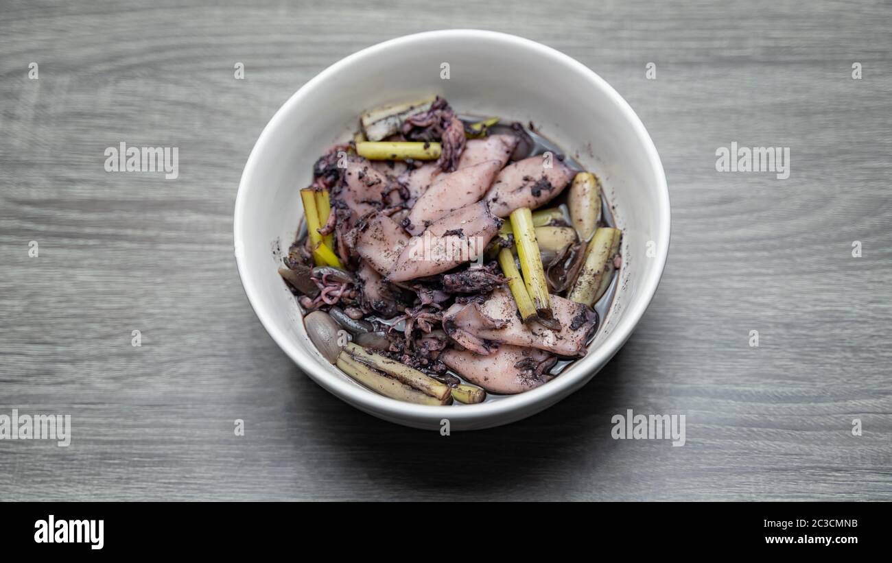 squid with lemon grass in black ink soup, seafood thai traditional ...