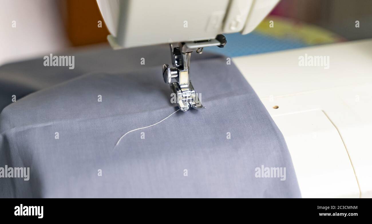 Electric sewing machine with fabric and thread Stock Photo - Alamy