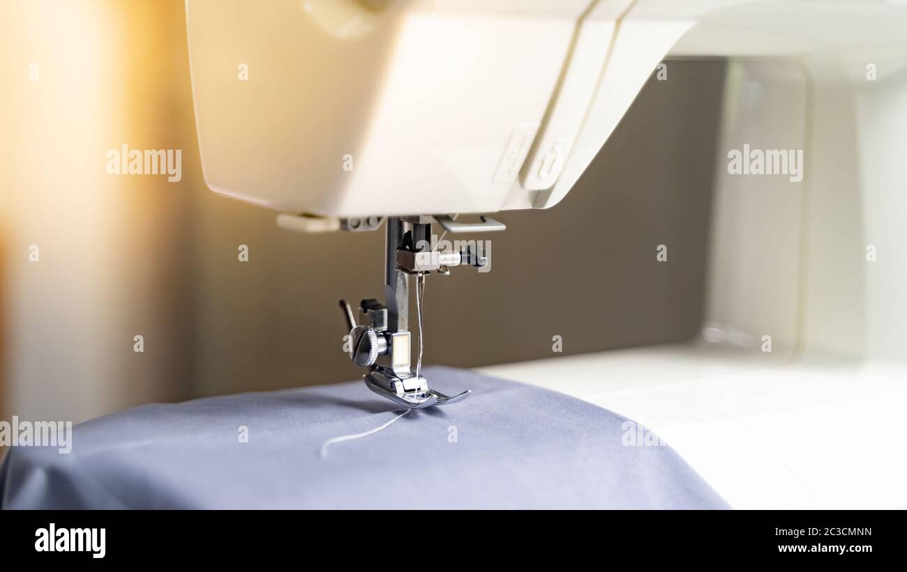 Electric sewing machine with fabric and thread Stock Photo - Alamy