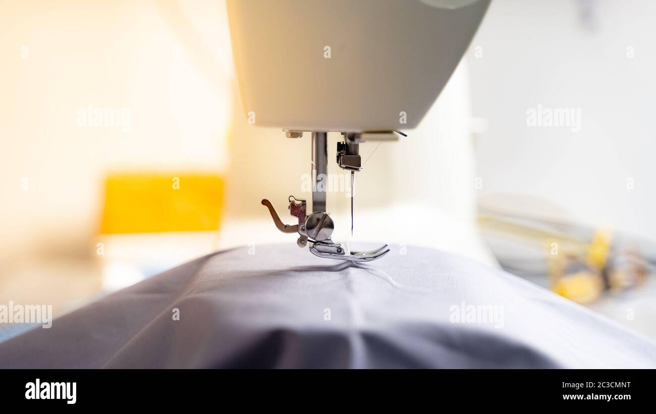 Electric sewing machine with fabric and thread Stock Photo - Alamy