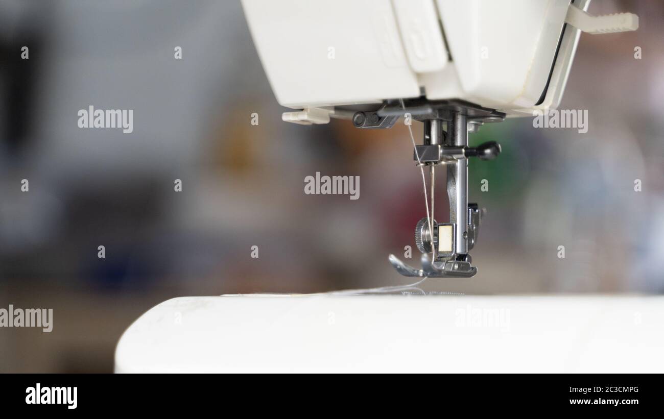 Electric sewing machine with fabric and thread Stock Photo - Alamy