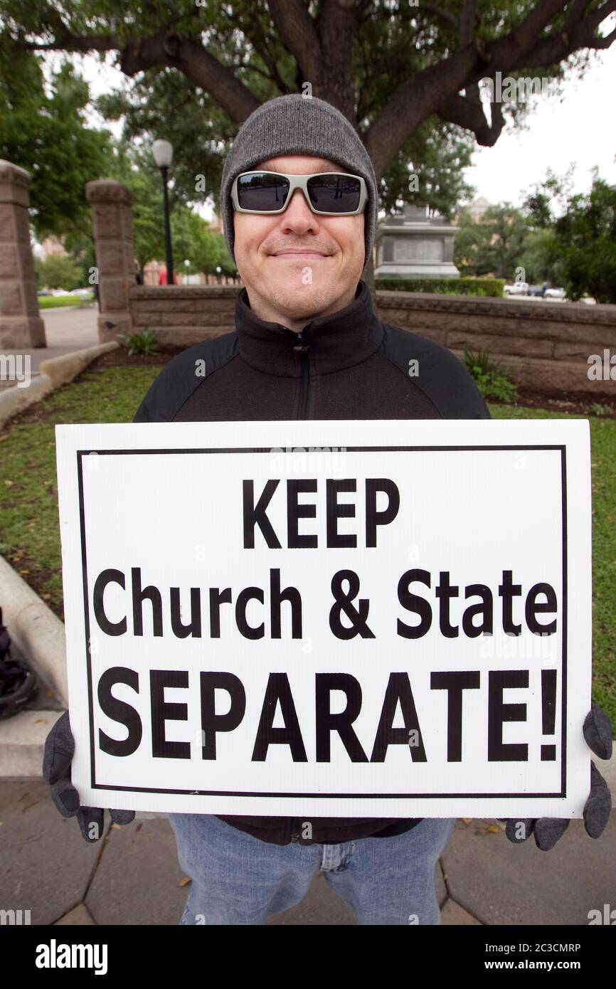 White male, holds up sign reading "Keep Church & State Separate ...
