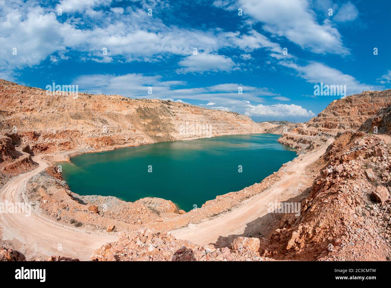 Emerald green lake in flooded opencast mine, open pit. Oval lake in ...