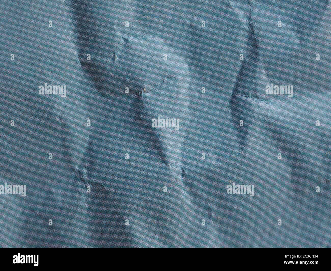 blue crinkled paper texture useful as a background Stock Photo - Alamy