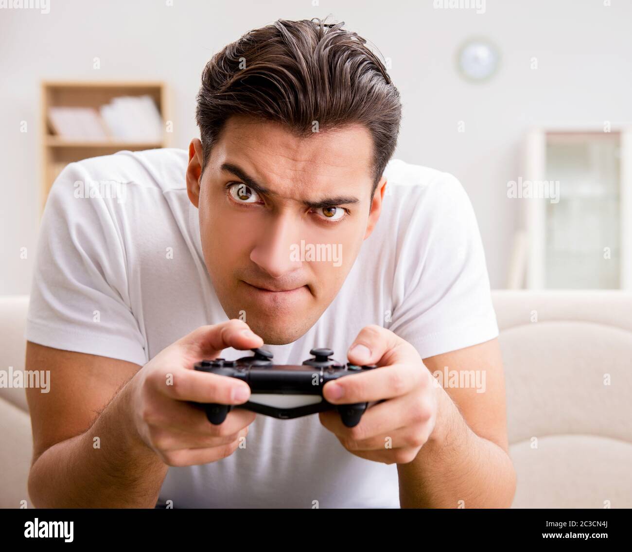 Man addicted to computer games Stock Photo - Alamy