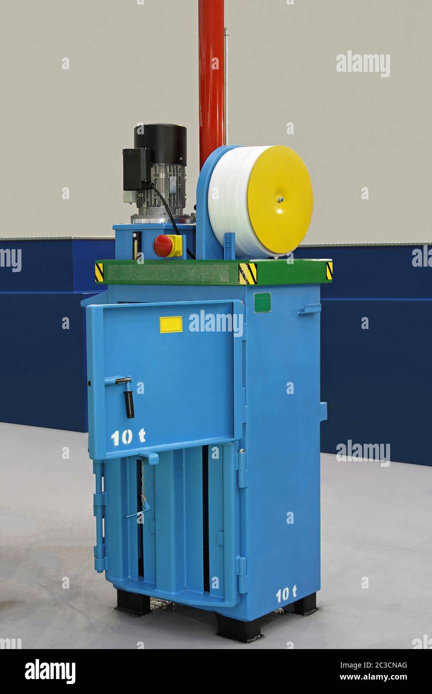 Hydraulic baling press machine for compacting plastic waste Stock Photo ...