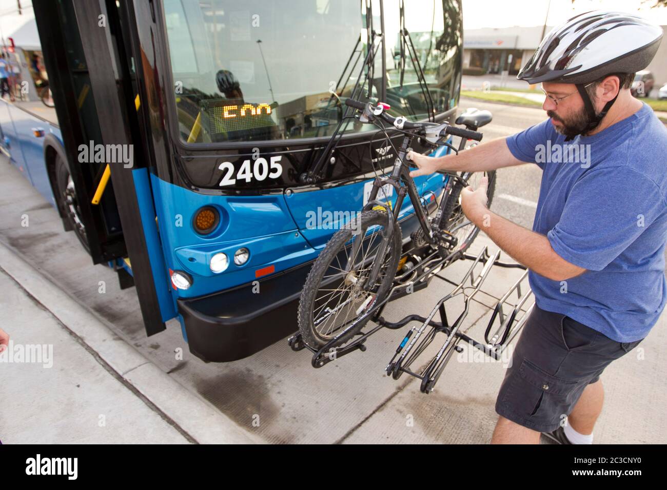 Austin Texas USA, 2013: Morning commuter uses rack to load his bicycle ...