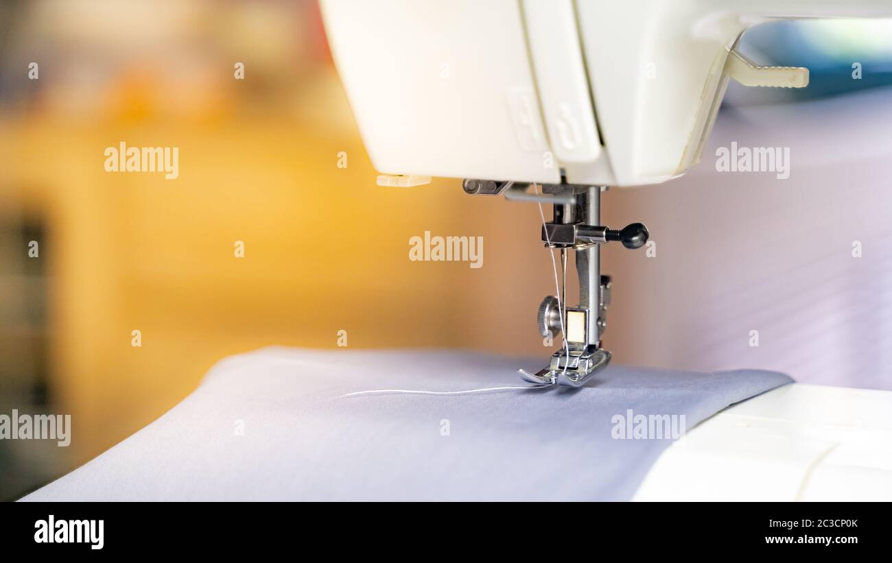 Electric sewing machine with fabric and thread Stock Photo - Alamy
