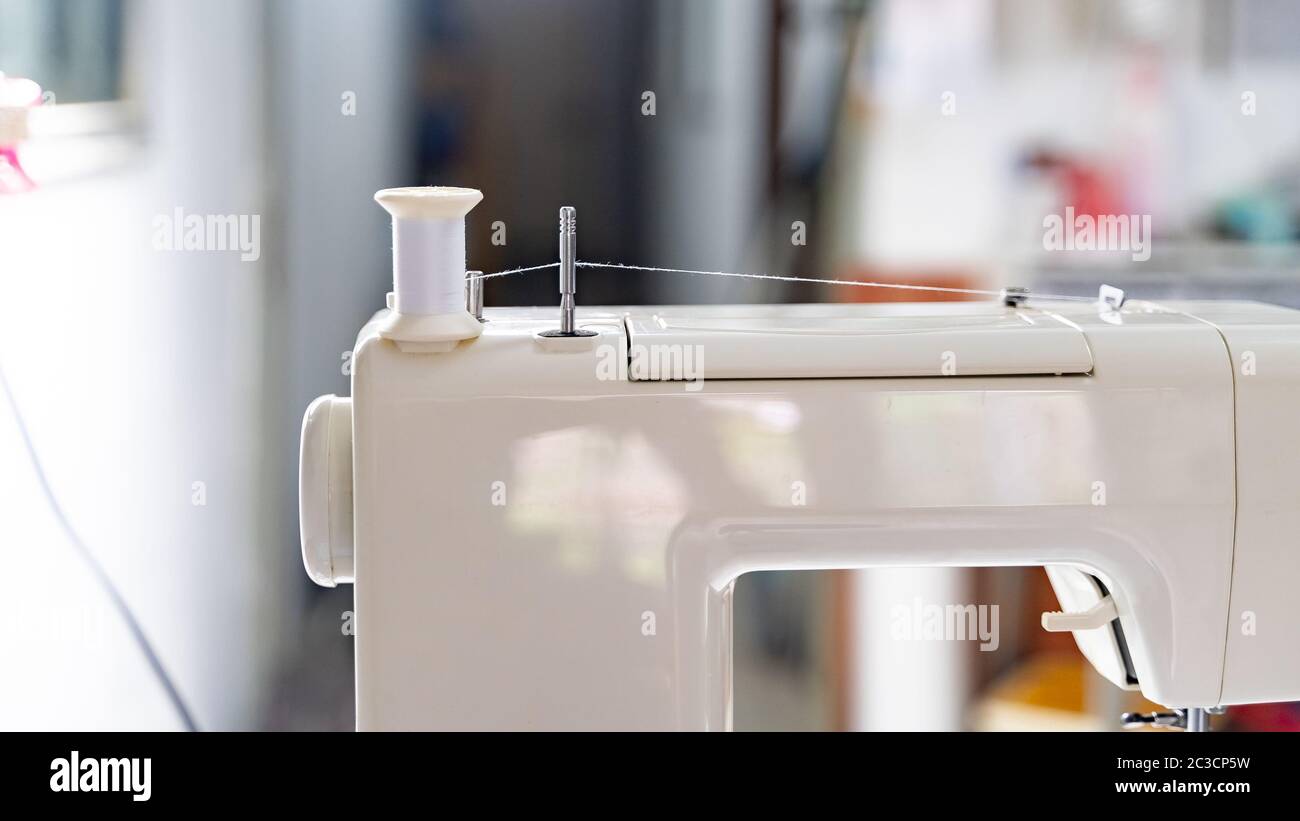 Electric sewing machine with fabric and thread Stock Photo - Alamy