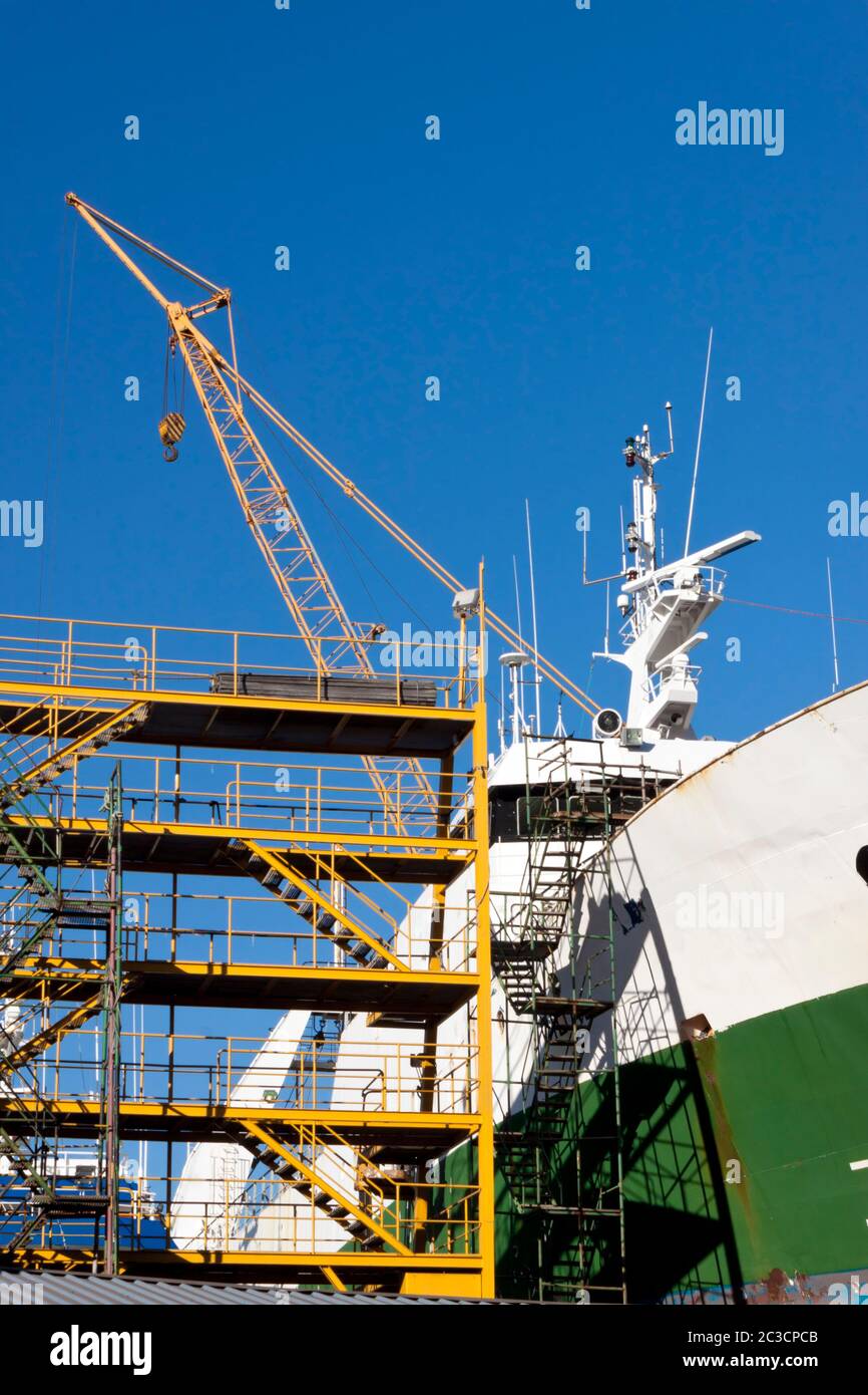 Ship in the shipyard for maintenance and repair work with scaffolds and ...