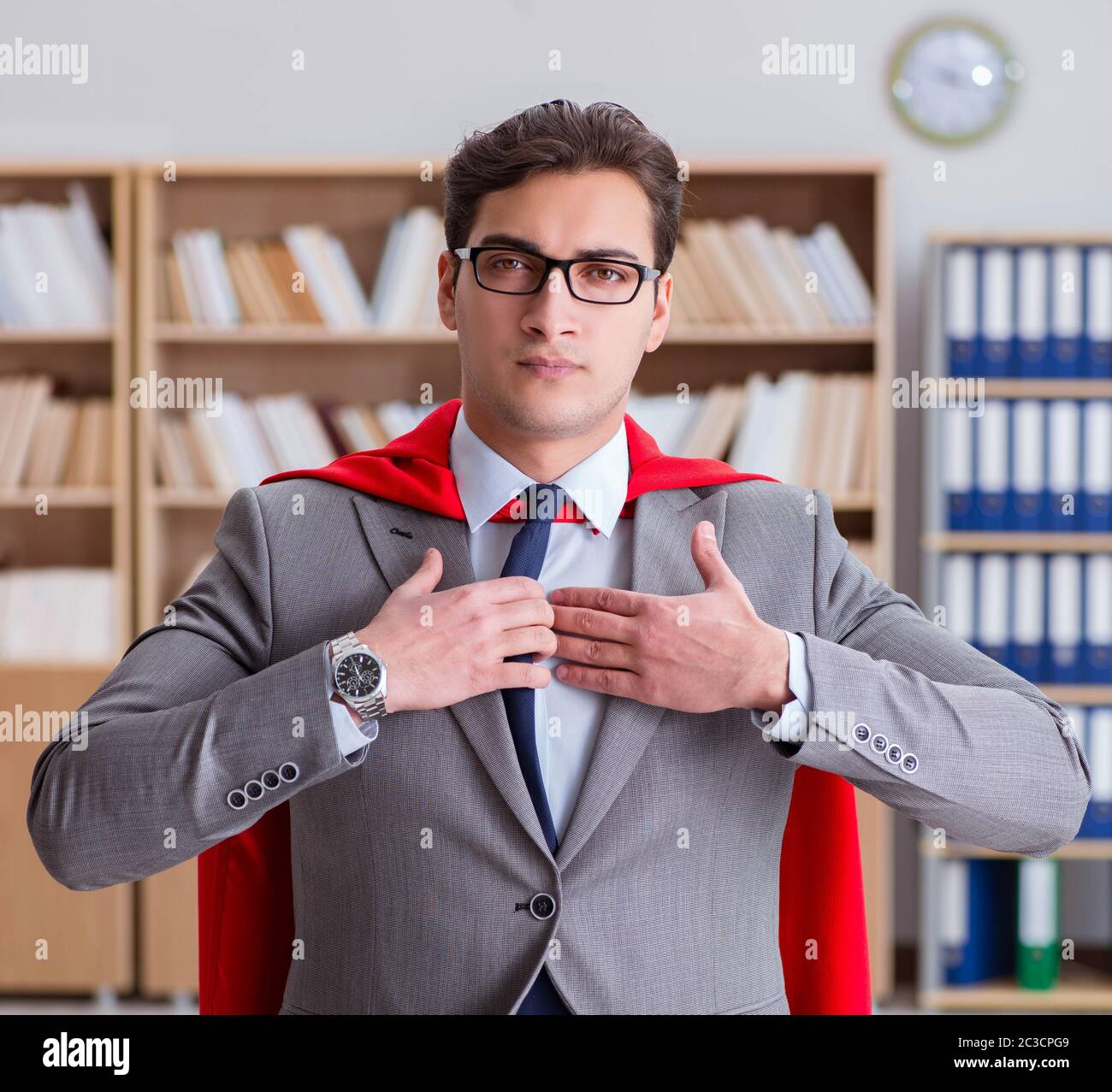 Superhero businessman working in the office Stock Photo - Alamy