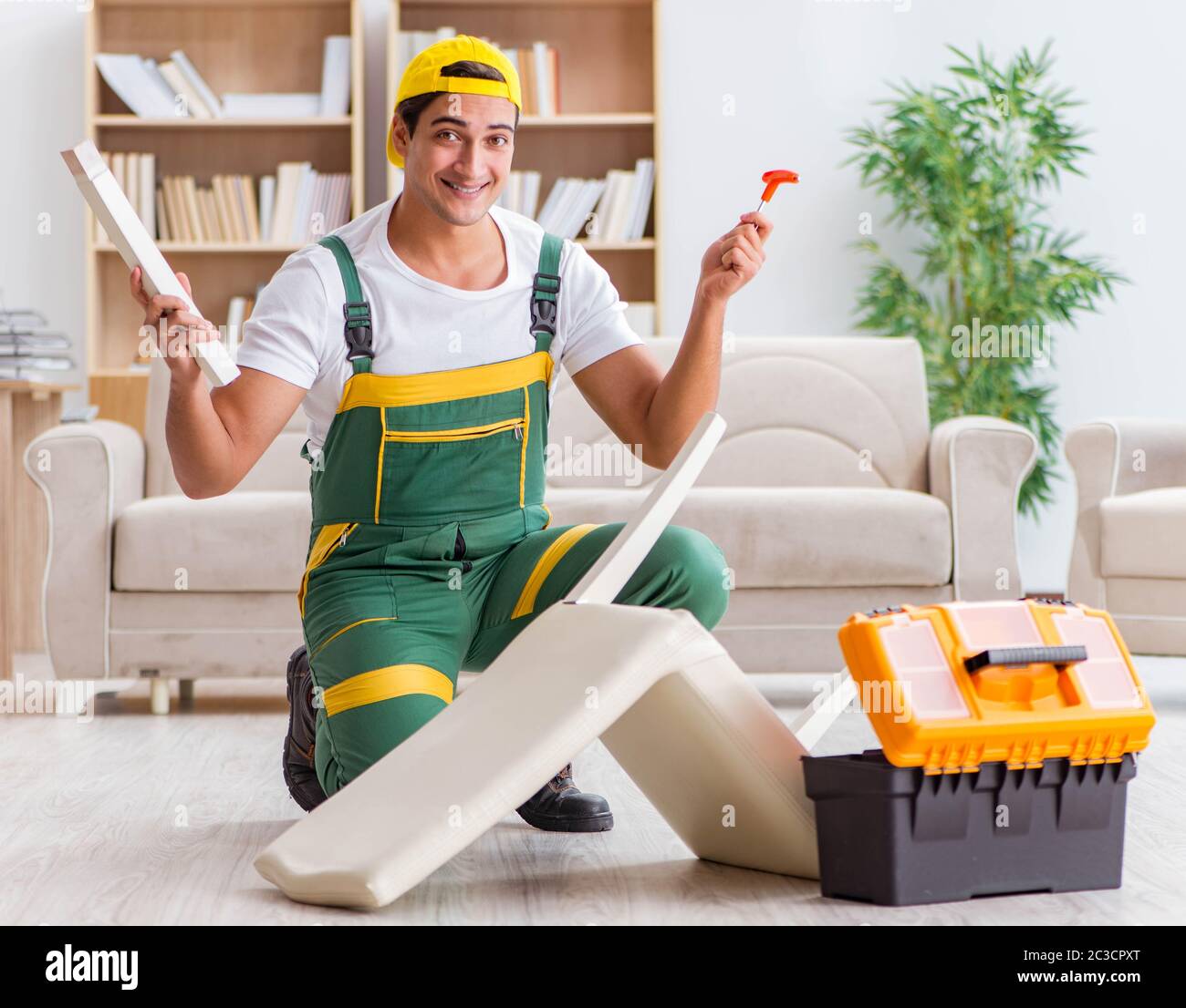 Worker repairing armchair hi-res stock photography and images - Alamy