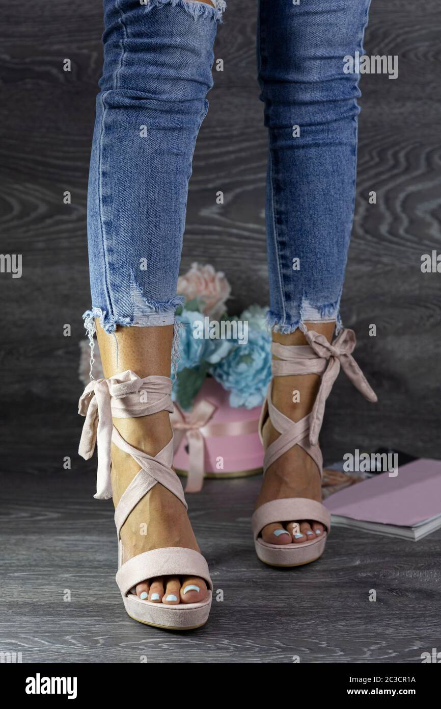 Woman posing in stylish high heel shoes. Beauty and Fashion concept ...