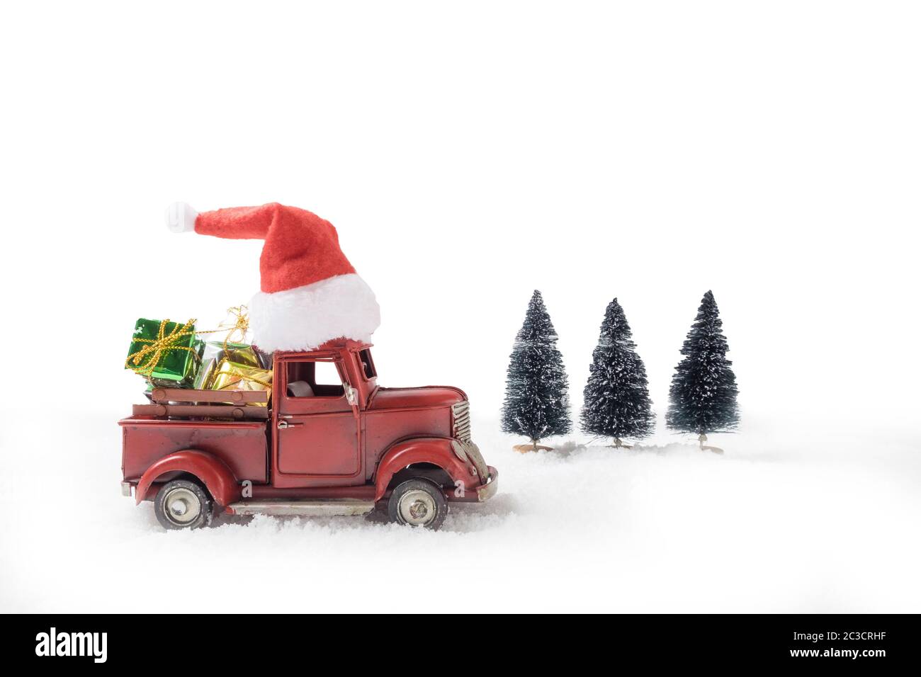 Christmas toy santa truck with gift boxes and pine tree on snow ...