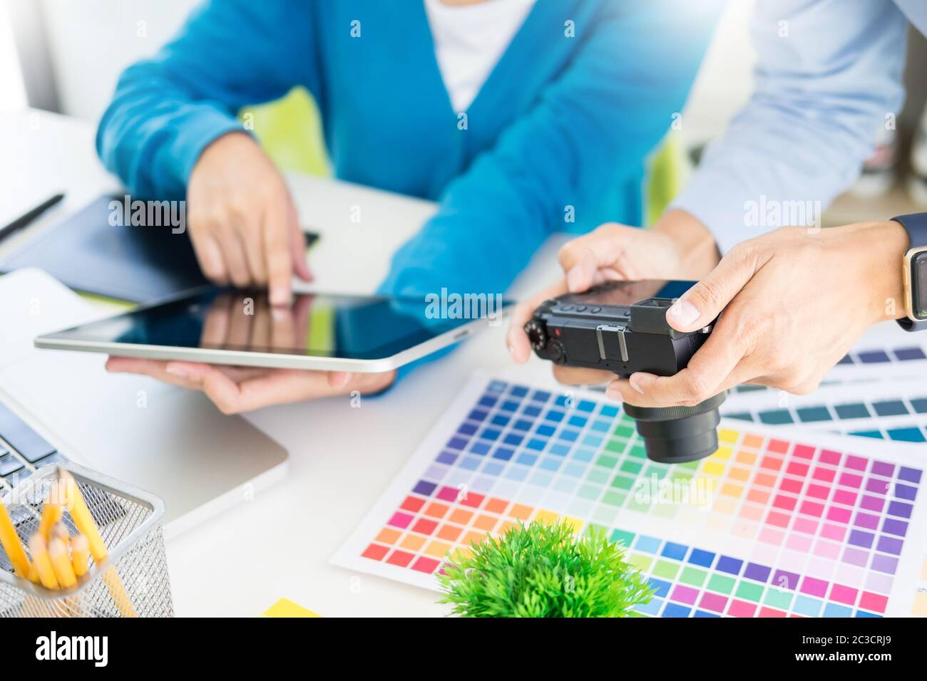 Creative or Interior designers teamwork with pantone swatch and ...