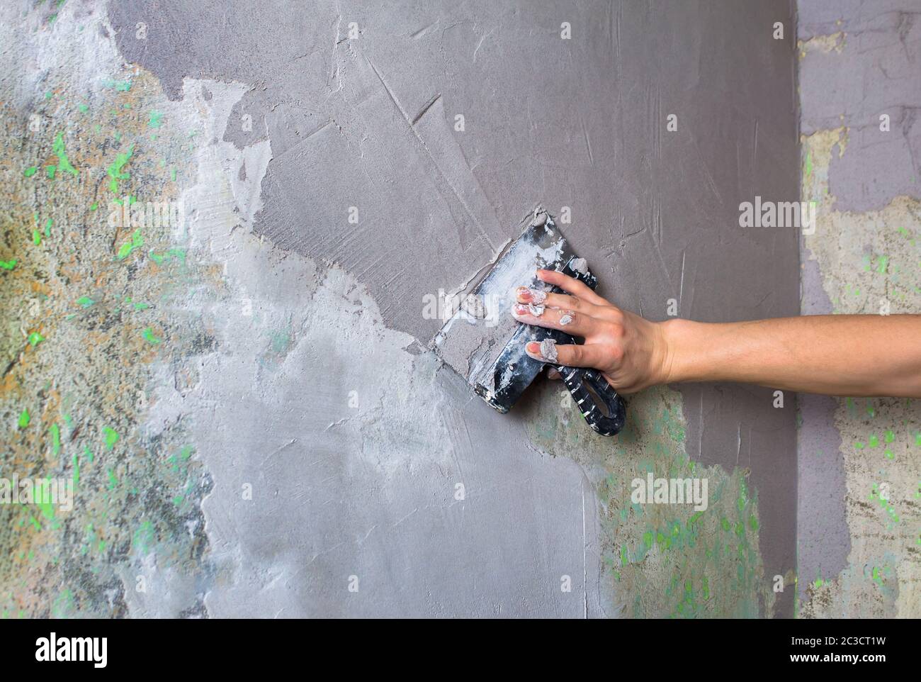 Repair the wall. Plaster the wall with a spatula. Internal construction ...