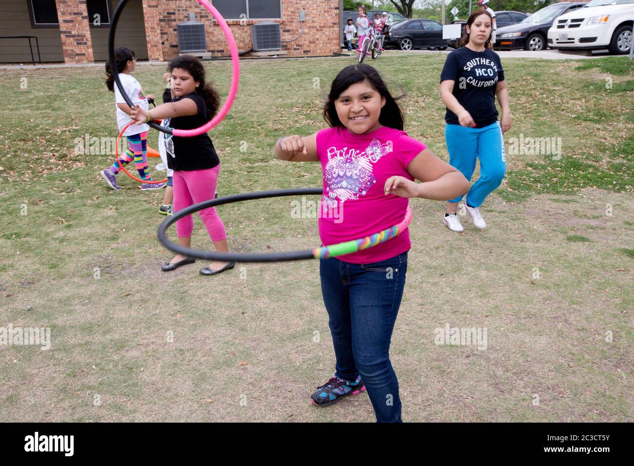 Hula hooping children hi-res stock photography and images - Alamy