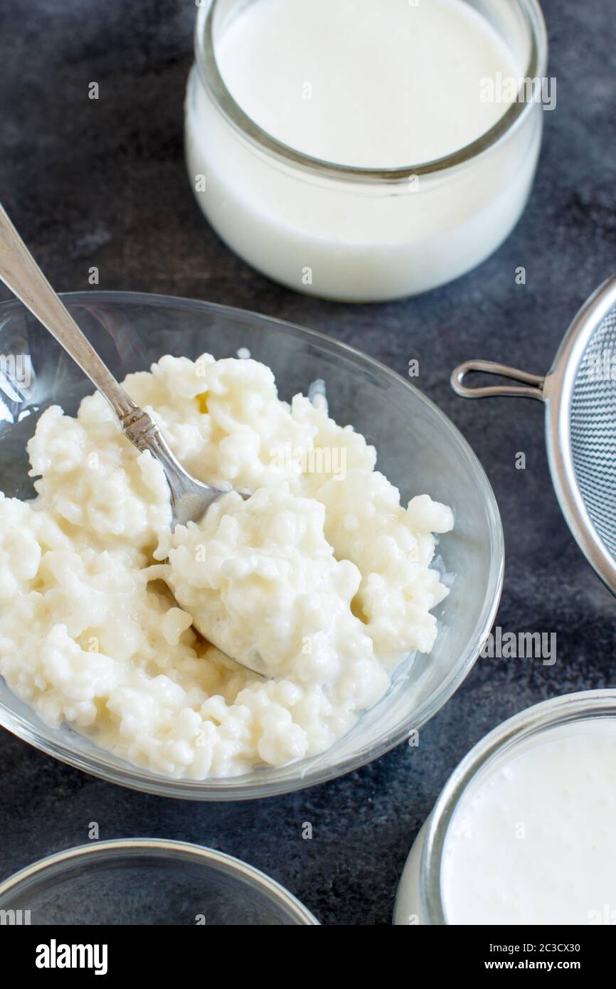 Kefir grains and fermented drink kefir close up Stock Photo - Alamy