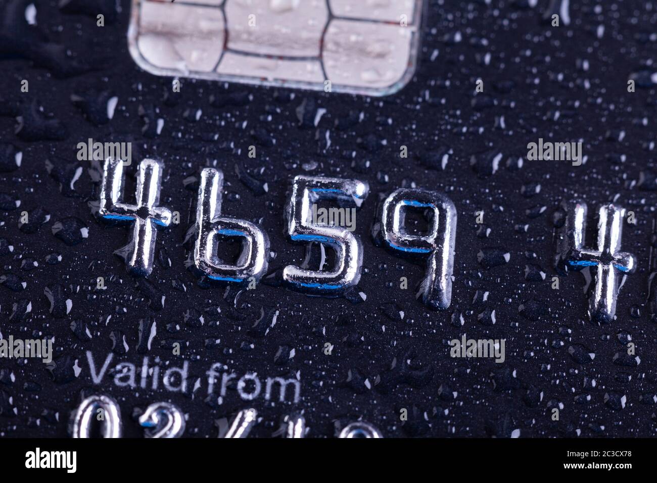 Credit card close up showing numbers and security chip Stock Photo - Alamy