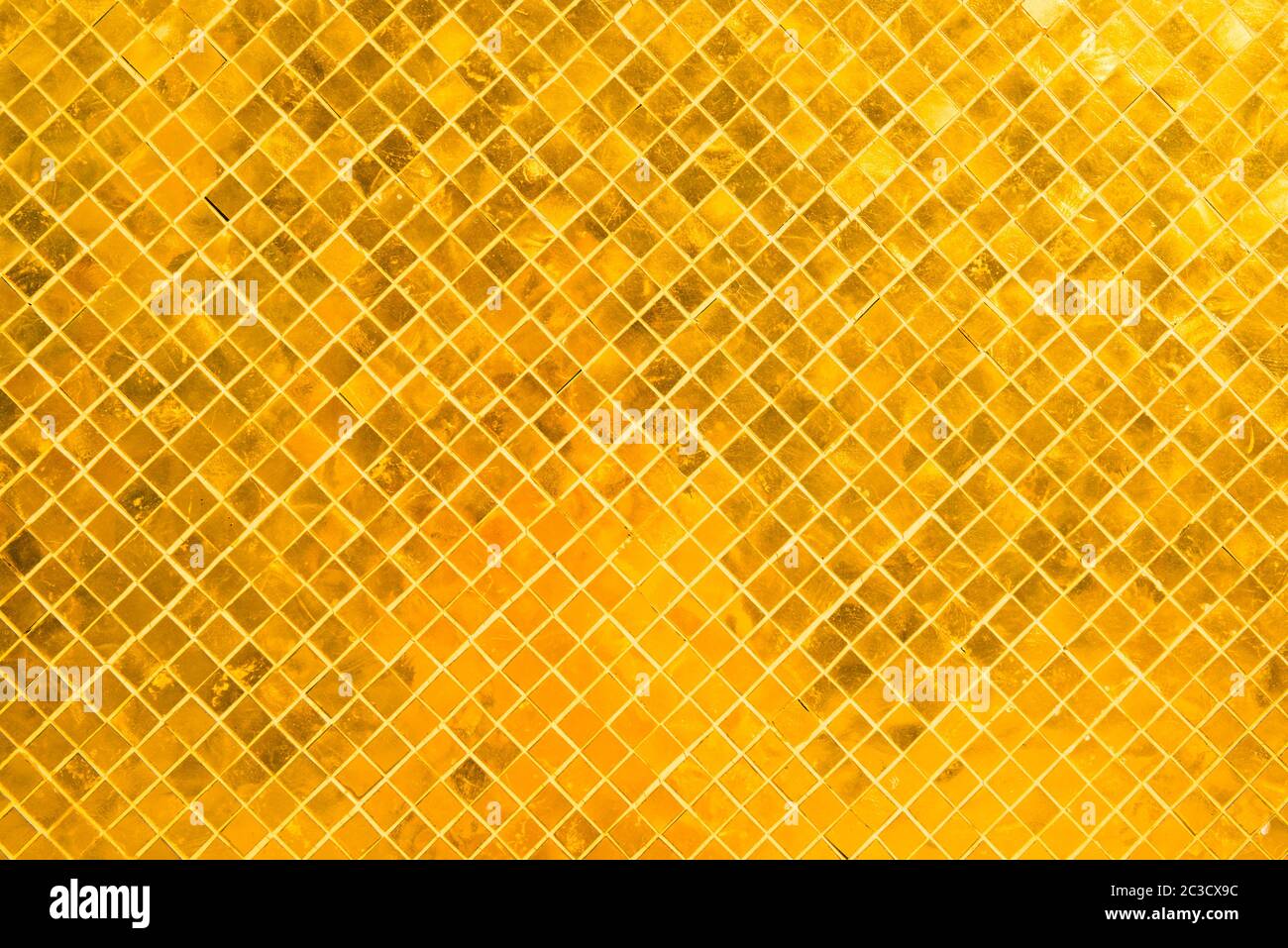 Closeup view of many gold shiny squares surface Stock Photo - Alamy