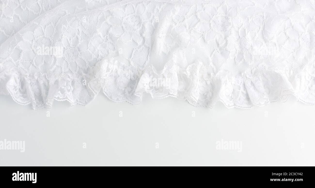 texture of crumpled white synthetic fabric guipure for sewing clothes ...