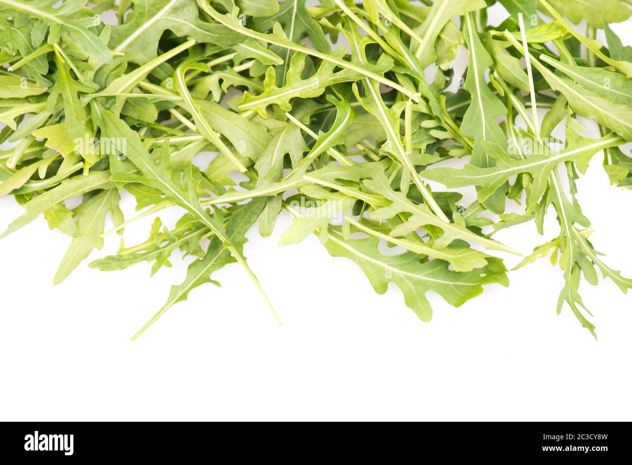 Arugula leaves isolated on a white background Stock Photo - Alamy