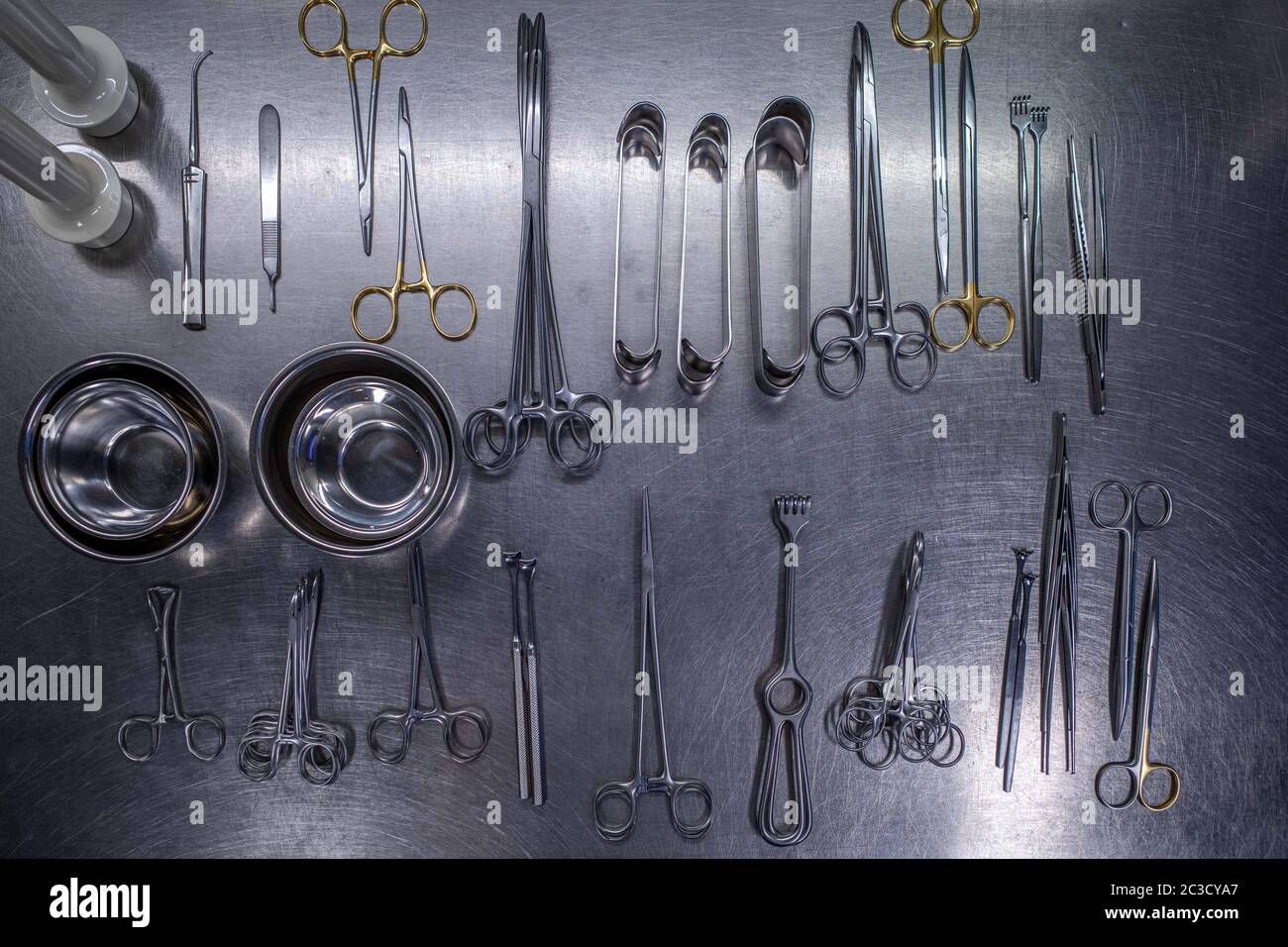 in sterilization department many cleaned instruments lie on a metal ...