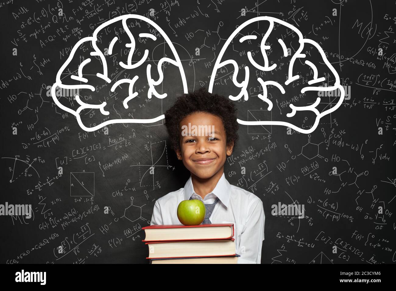 Happy smart kid student on blackboard background, brainstorming concept ...