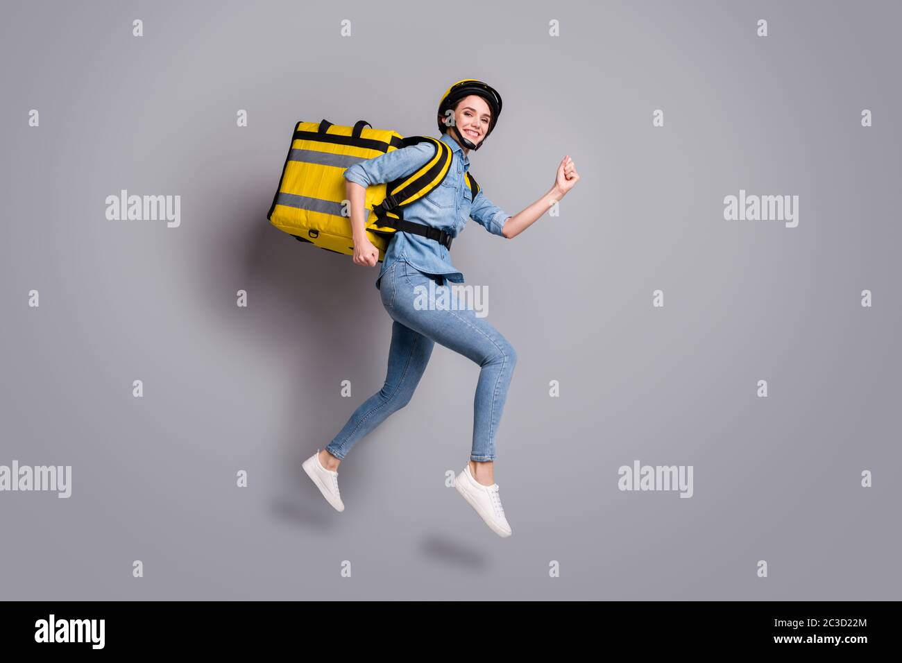 Full body photo positive girl courier jump run want fast deliver meal ...