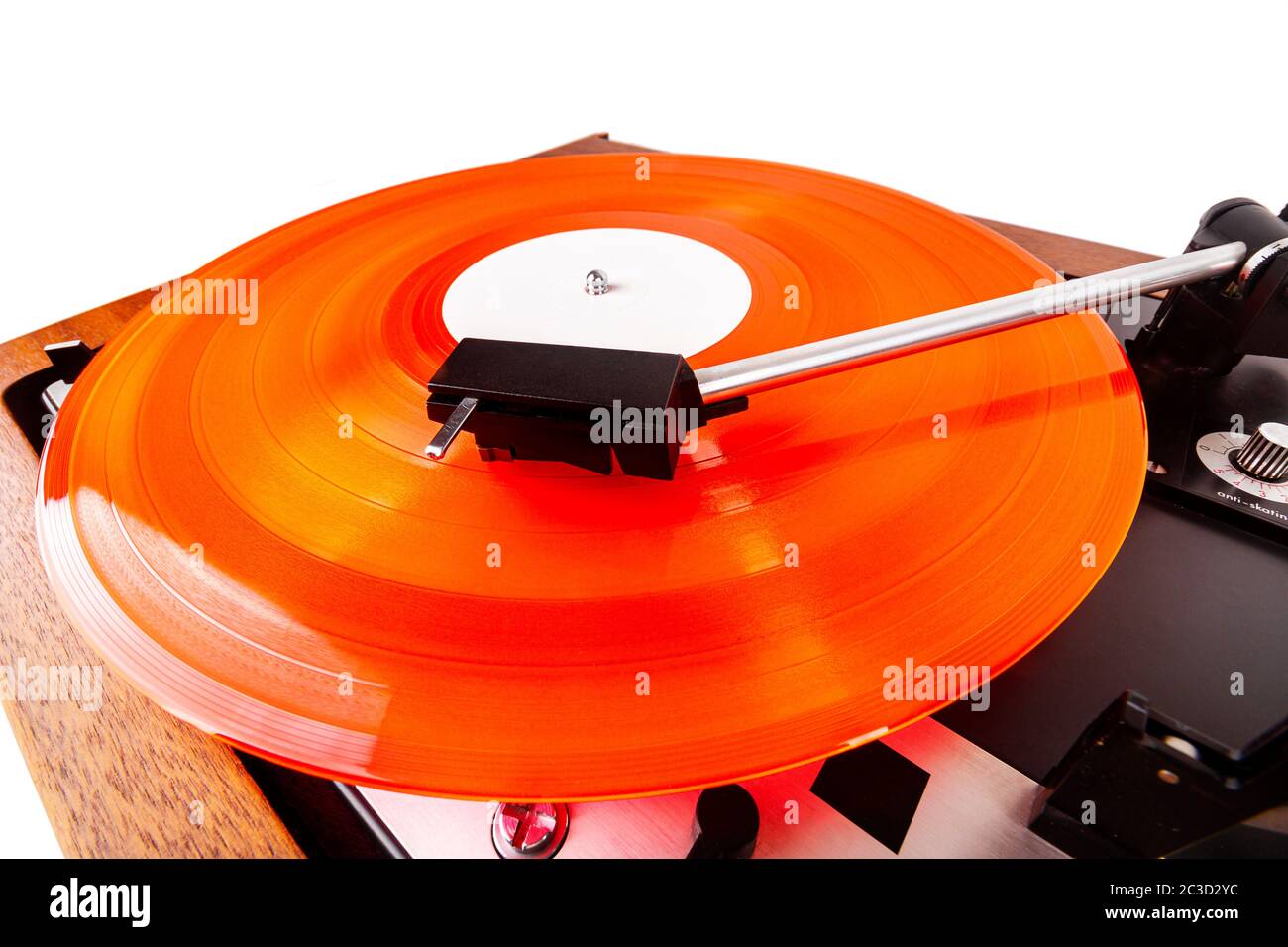 Vintage turntable with a red vinyl isolated on white. Wooden plinth ...