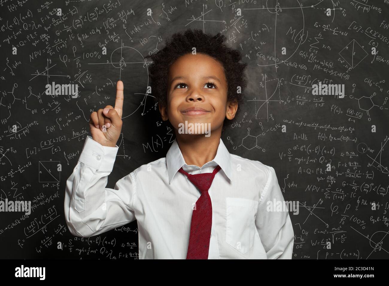 Black kid student pointing at science formulas on chalkboard Stock ...
