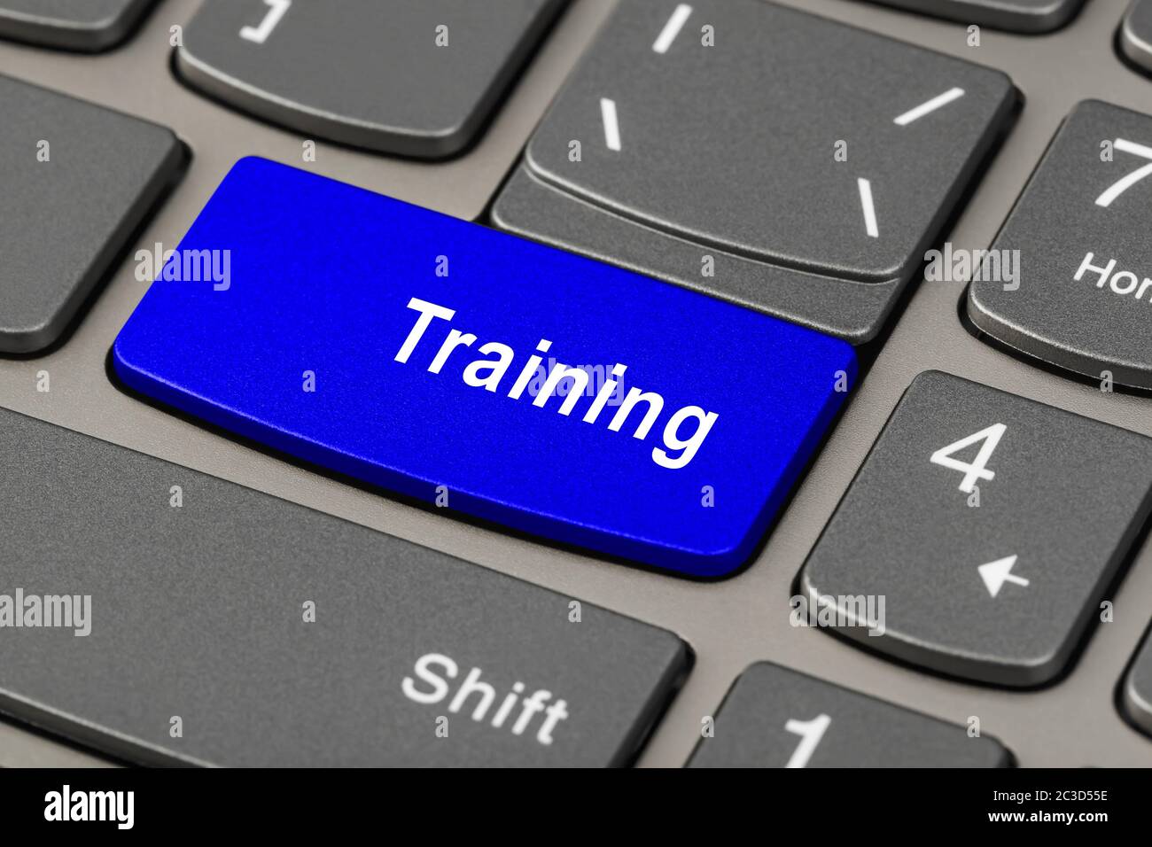 Computer notebook keyboard with Training key Stock Photo - Alamy