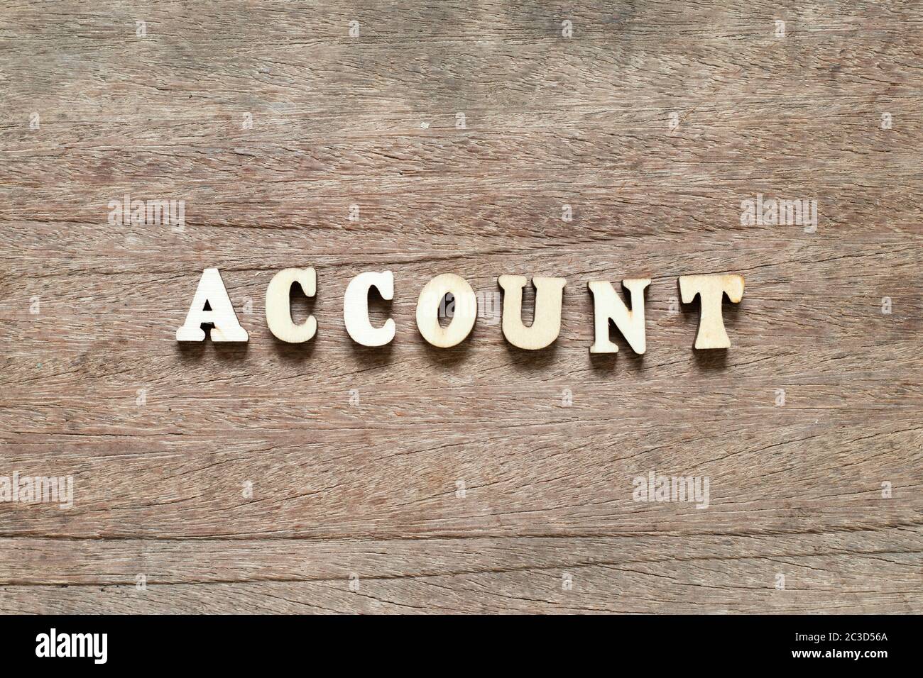 Letter block in word account on wood background Stock Photo - Alamy