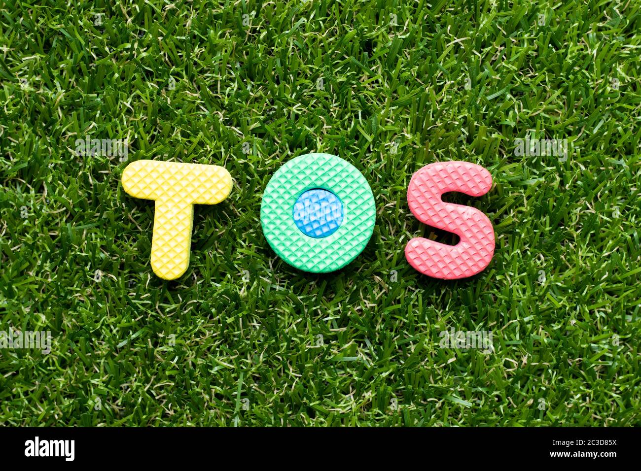 Toy foam letter in word TOS (abbreviation of Terms Of Service) on green ...