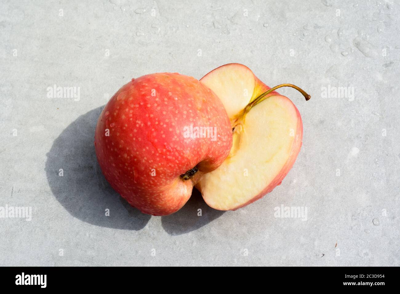 Cutting an apple fresh fruit preperation inside a kitchen on a chopping ...