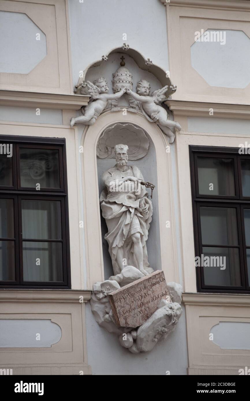 Architecture in central square in Vienna. Historical statueon wall of ...