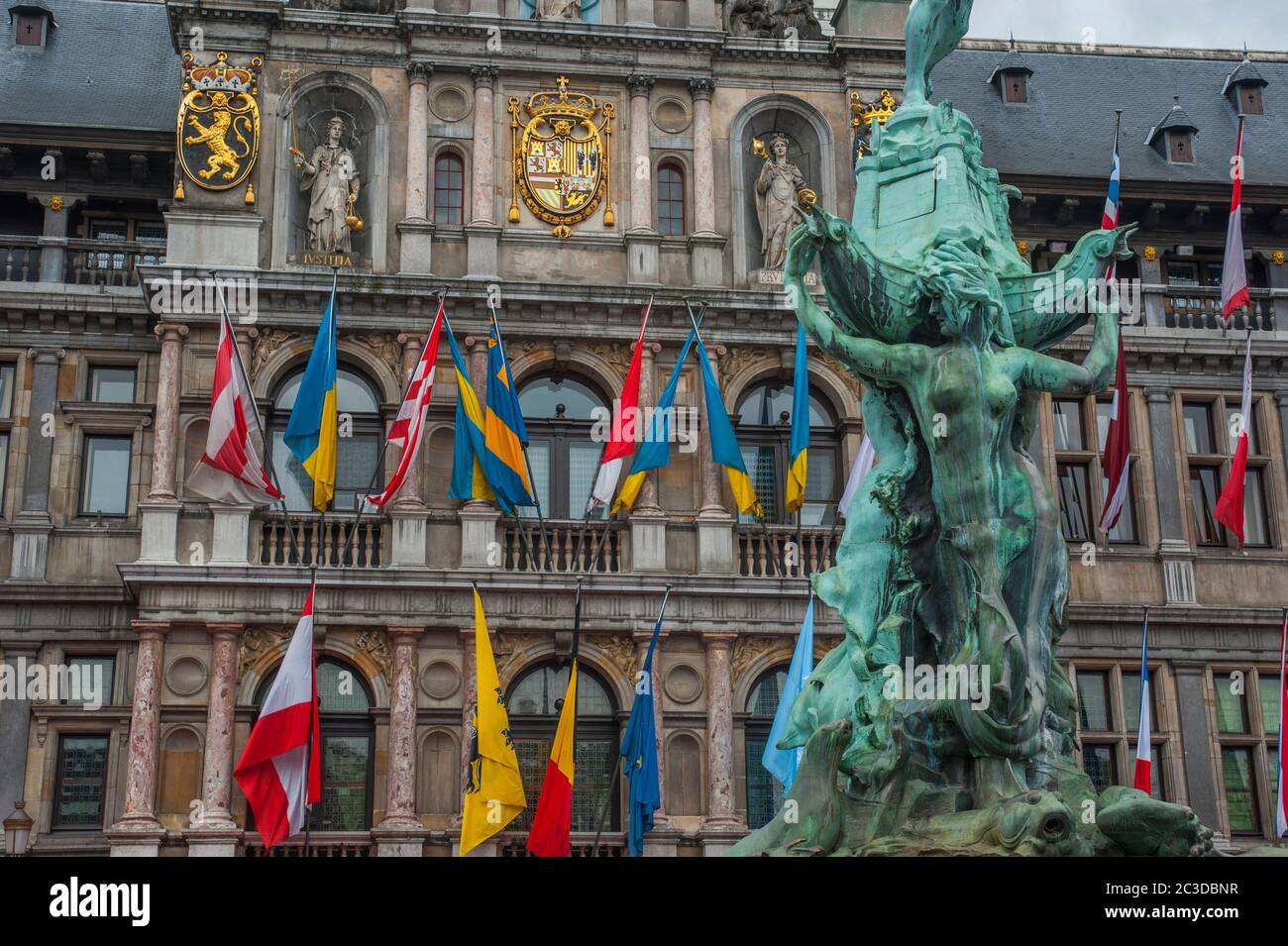 The market square in Antwerp, Belgium, with the statue which shows the ...