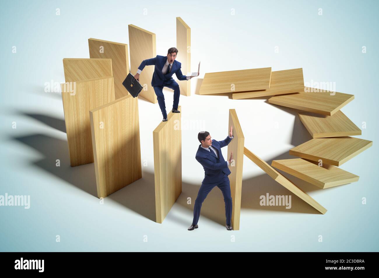Domino effect and competition concept Stock Photo - Alamy
