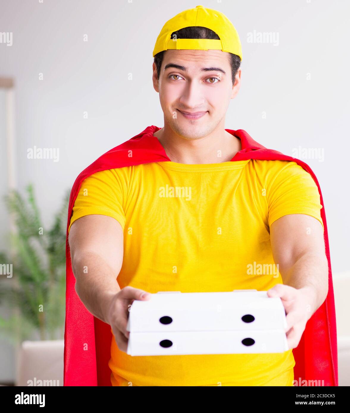 Superhero pizza delivery guy with red cover Stock Photo - Alamy