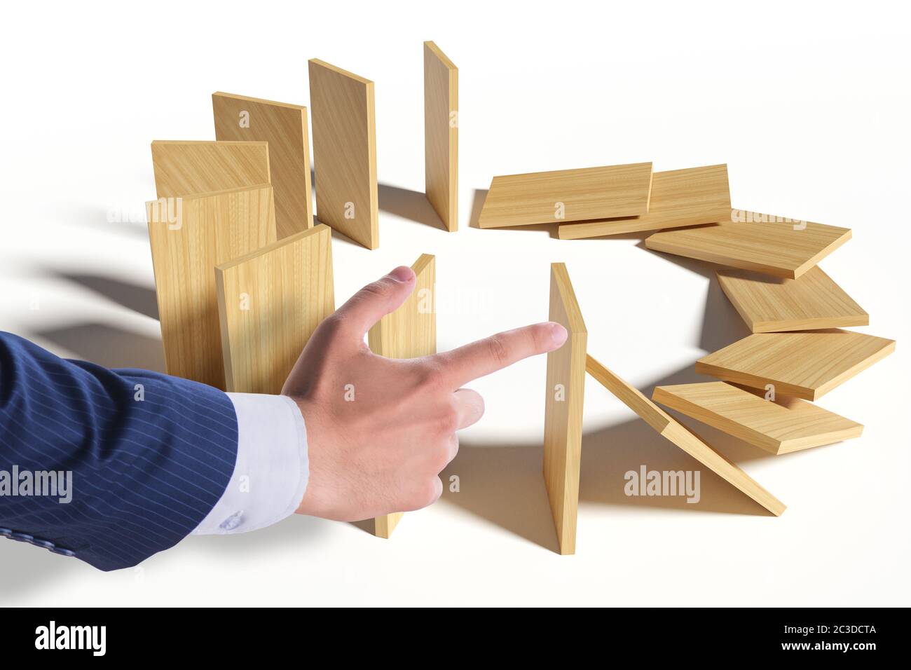 Domino effect and competition concept Stock Photo - Alamy