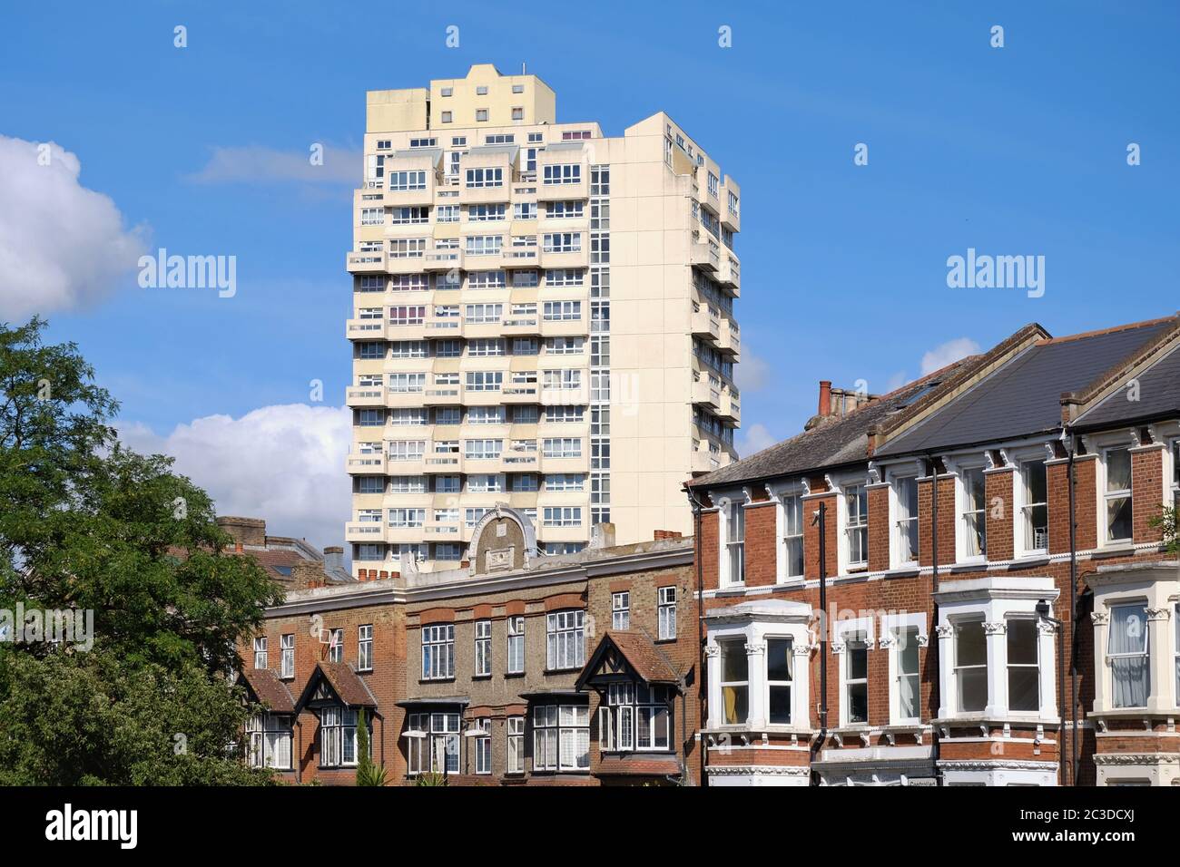 Red brick early 20th century housing against the backdrop of mid-20th ...