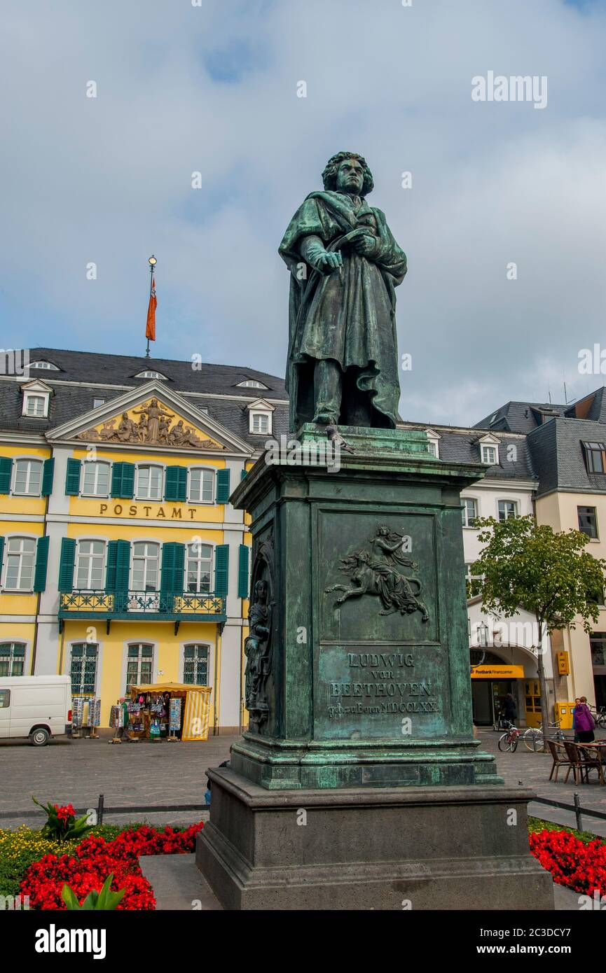 A statue of Ludwig van Beethoven standing on the Bonn Minster Square in ...