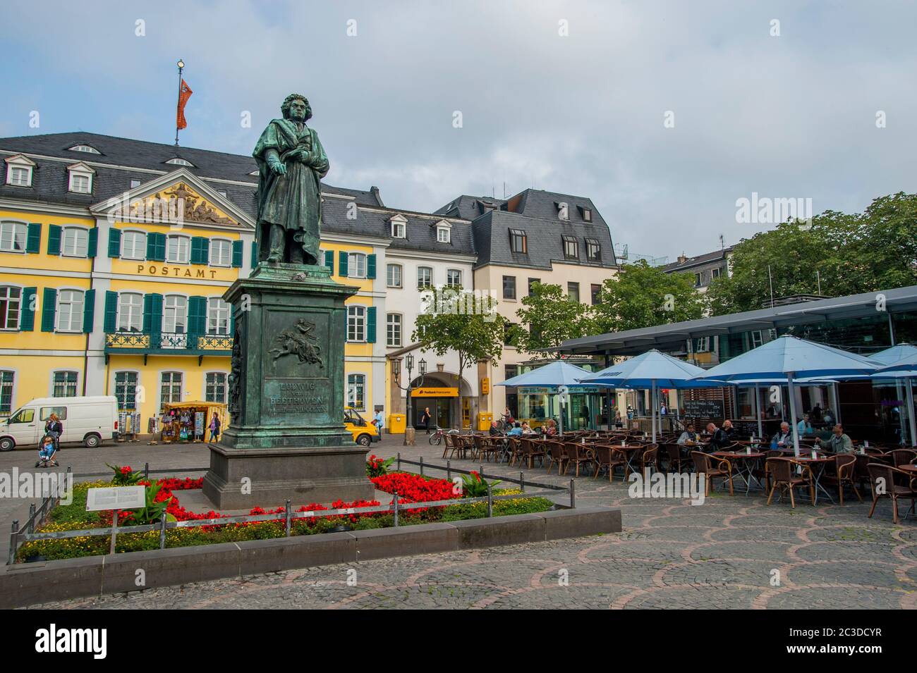A statue of Ludwig van Beethoven standing on the Bonn Minster Square in ...