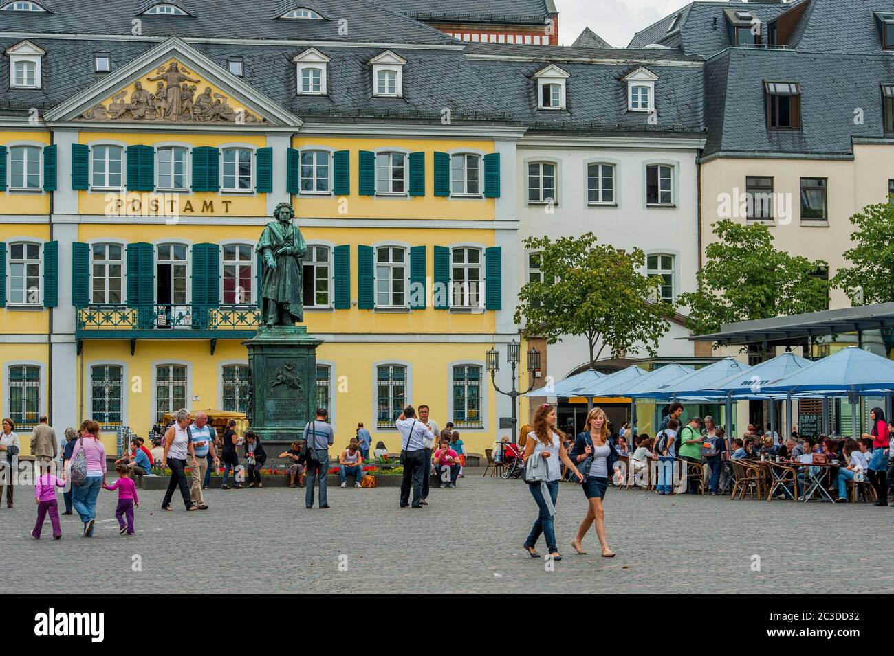A statue of Ludwig van Beethoven standing on the Bonn Minster Square in ...