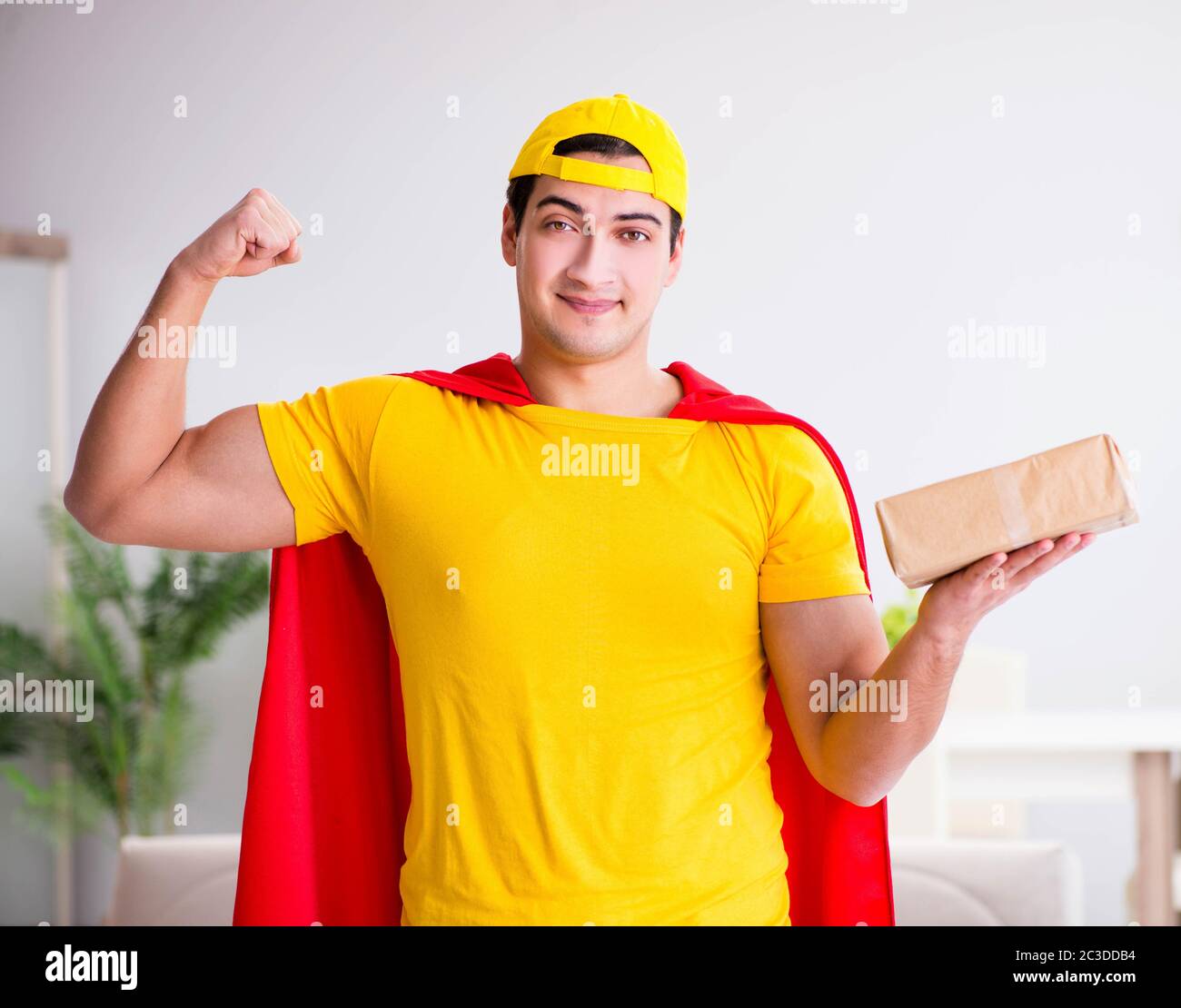 Superhero delivery guy with box Stock Photo - Alamy