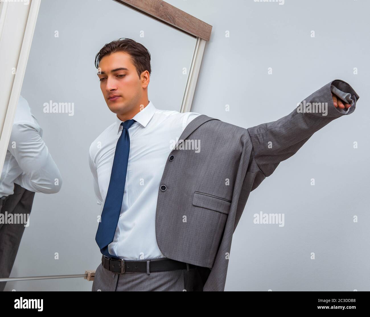 Businessman dressing up for work Stock Photo - Alamy