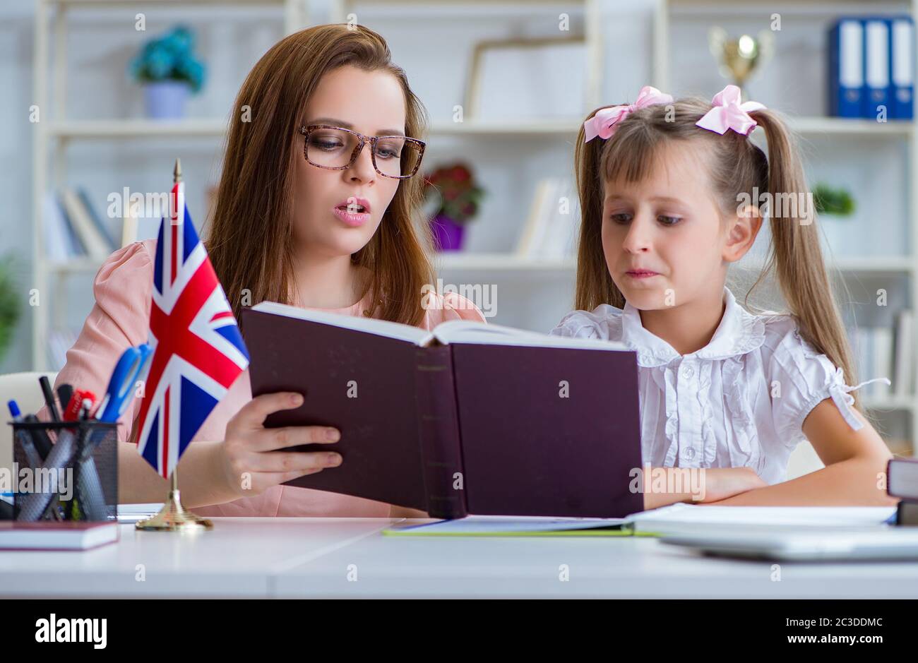 Young girl learning english with teacher Stock Photo - Alamy