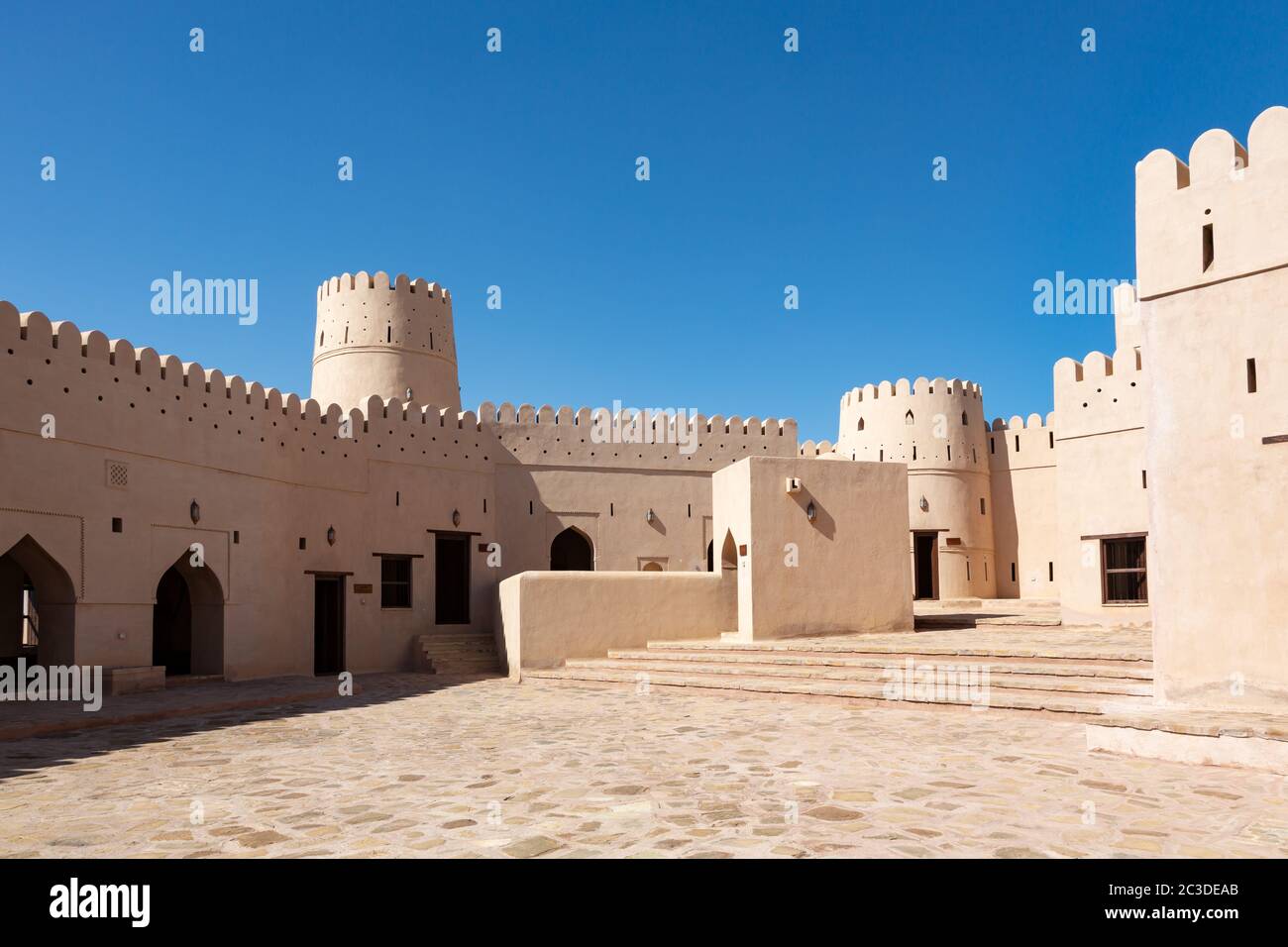 Patio of fort of Bani bu Hassan, Oman, with its typical beige clay ...