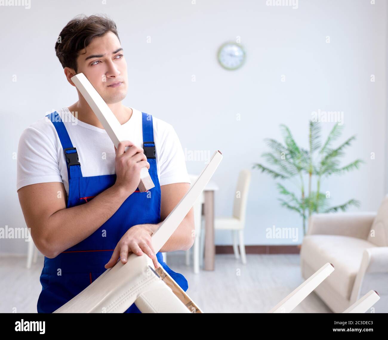Man repairing chair hi-res stock photography and images - Alamy